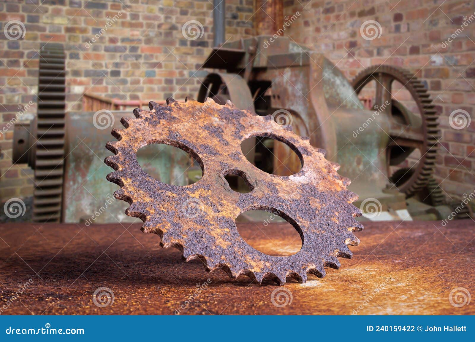 Rusty old cog with a face stock photo. Image of rusty - 240159422