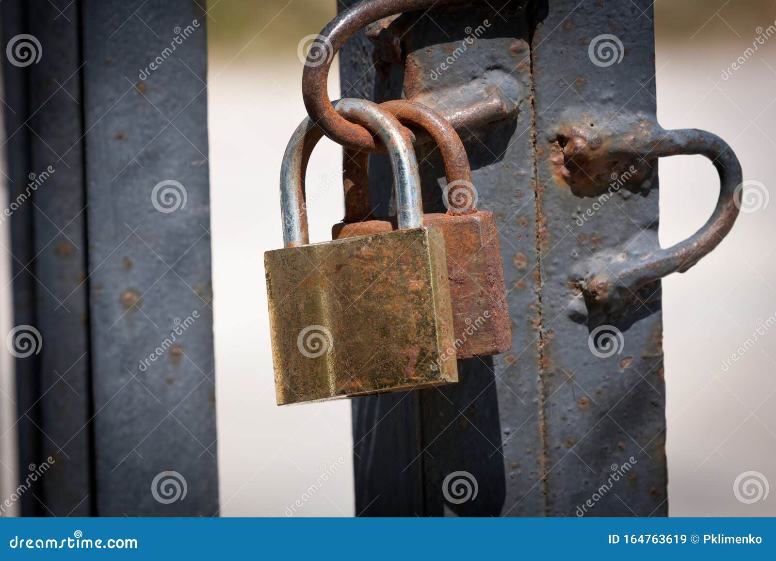 Rusty old locks on gate stock image. Image of retro - 164763619