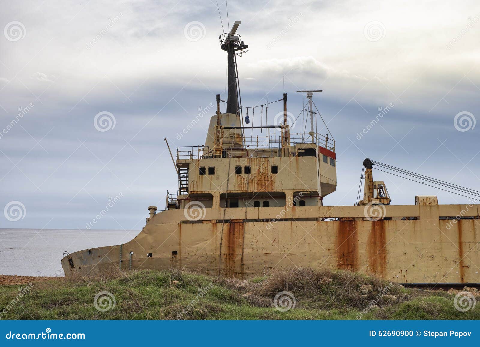Rusty old ship near shore stock photo. Image of steel - 62690900