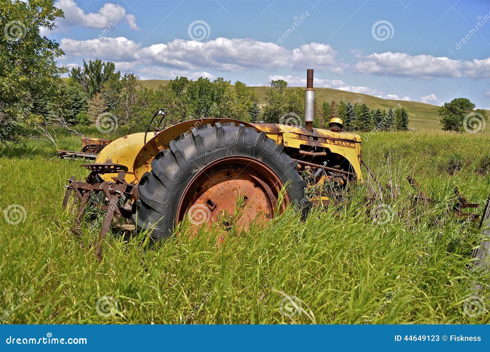 Rusty Old Tractor Buried in Long Grass Stock Image - Image of rust ...