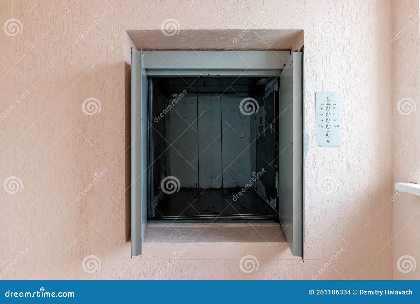 A Rusty Old Transport Elevator in the Wall is Opened Stock Photo ...