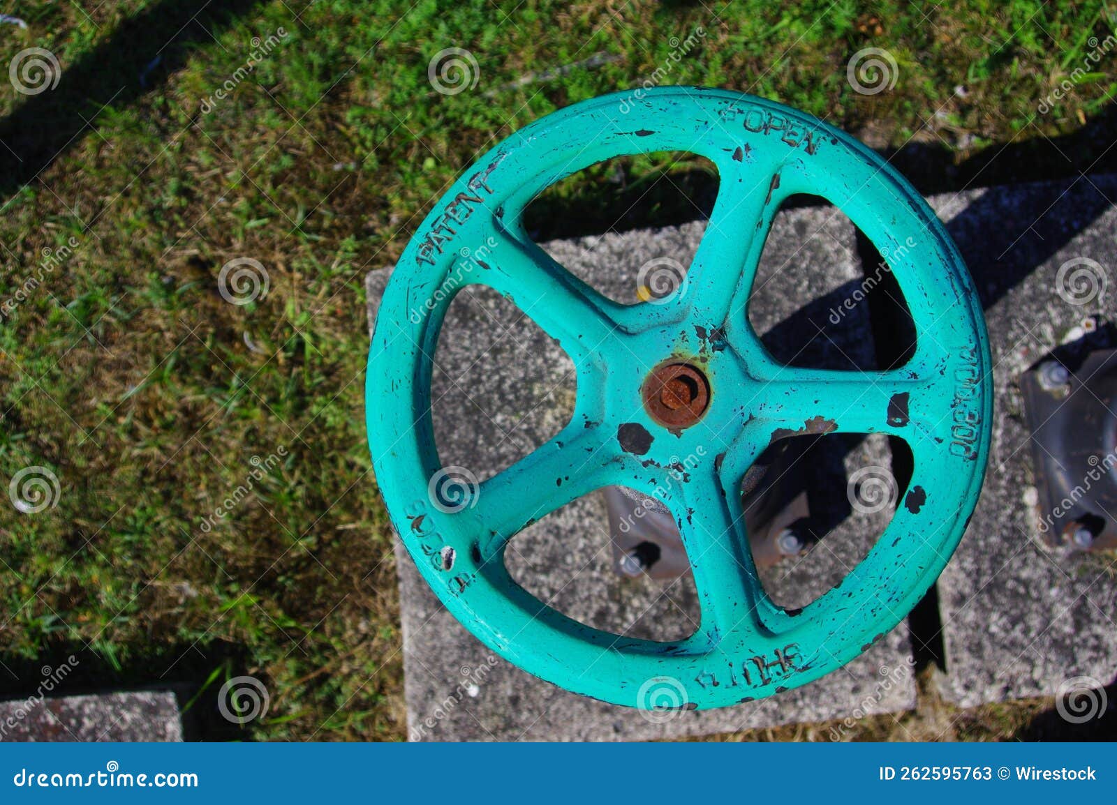 Rusty Old Turquoise Wheel at an Industrial Site Stock Image - Image of ...