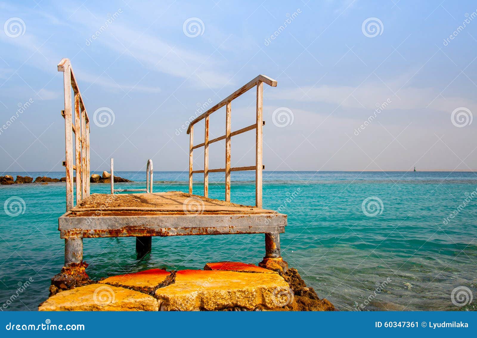 Rusty Pier and blue sea stock image. Image of lost, beach - 60347361