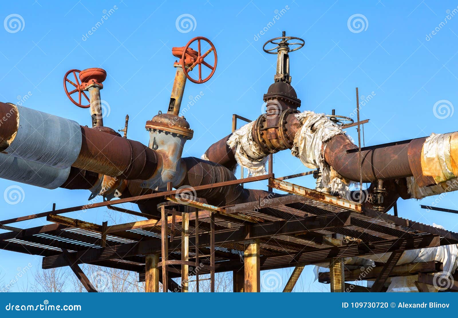 Rusty Pipeline with Valves Against the Blue Sky Background Stock Photo ...