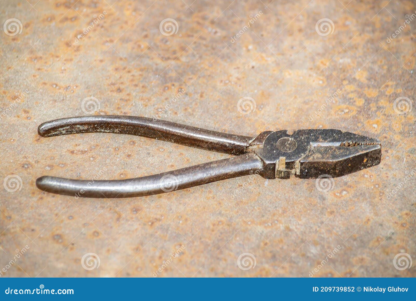 Rusty Pliers on Rust Background. Subject Shot. Front and Top View Stock ...