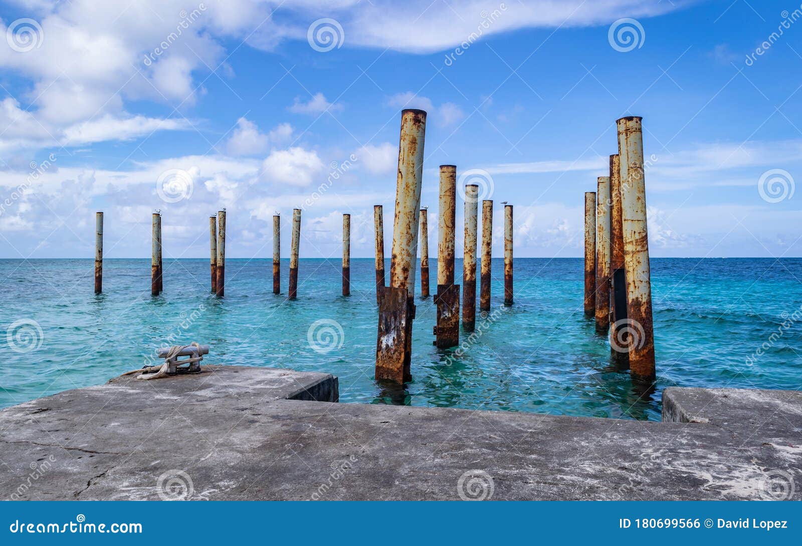 Rusty Poles in Ruins of Old Pier Stock Photo - Image of colombia, cove ...