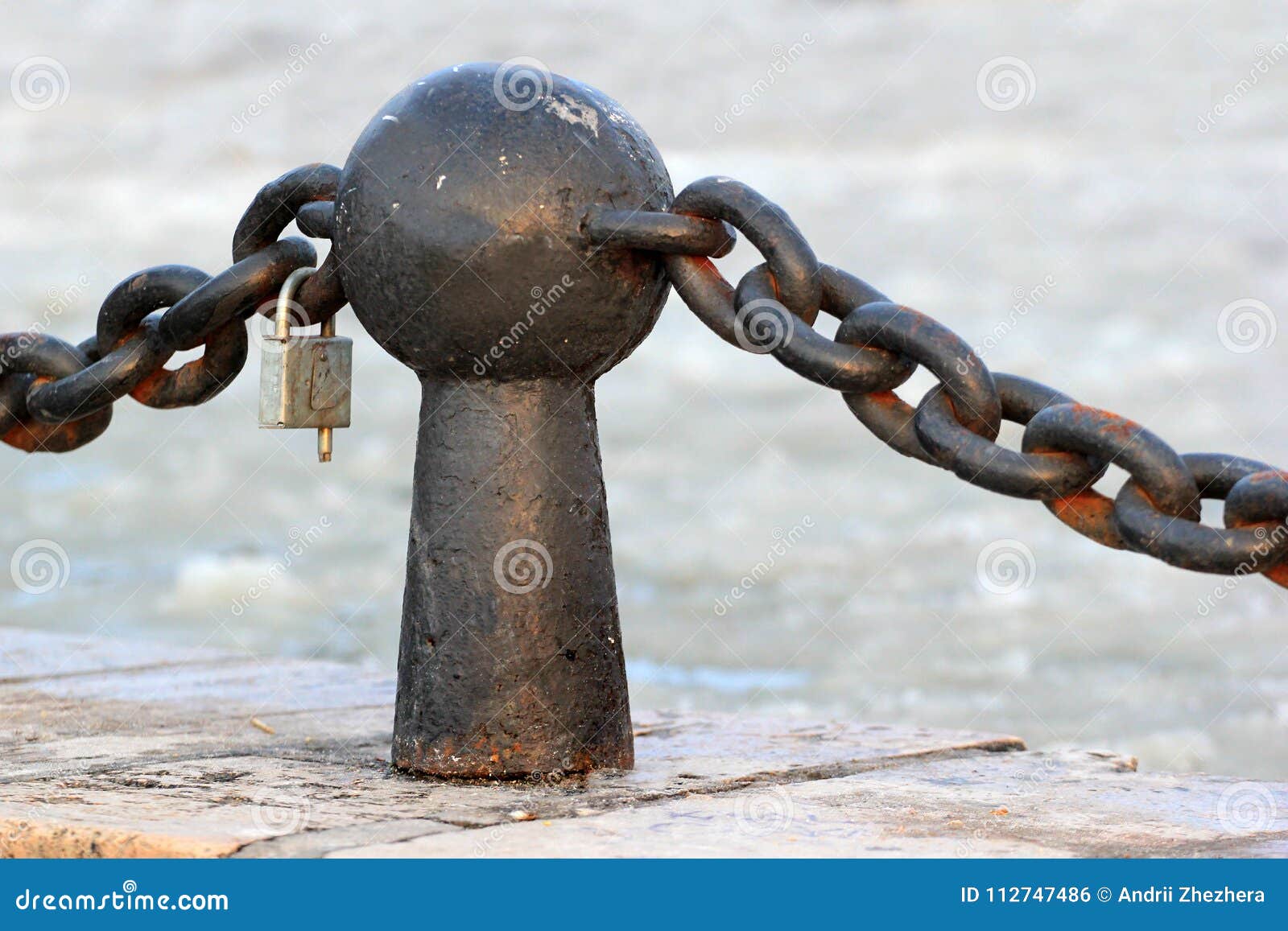 Rusty Post of Decorative Metal Fence with Chain and Padlock Stock Photo ...