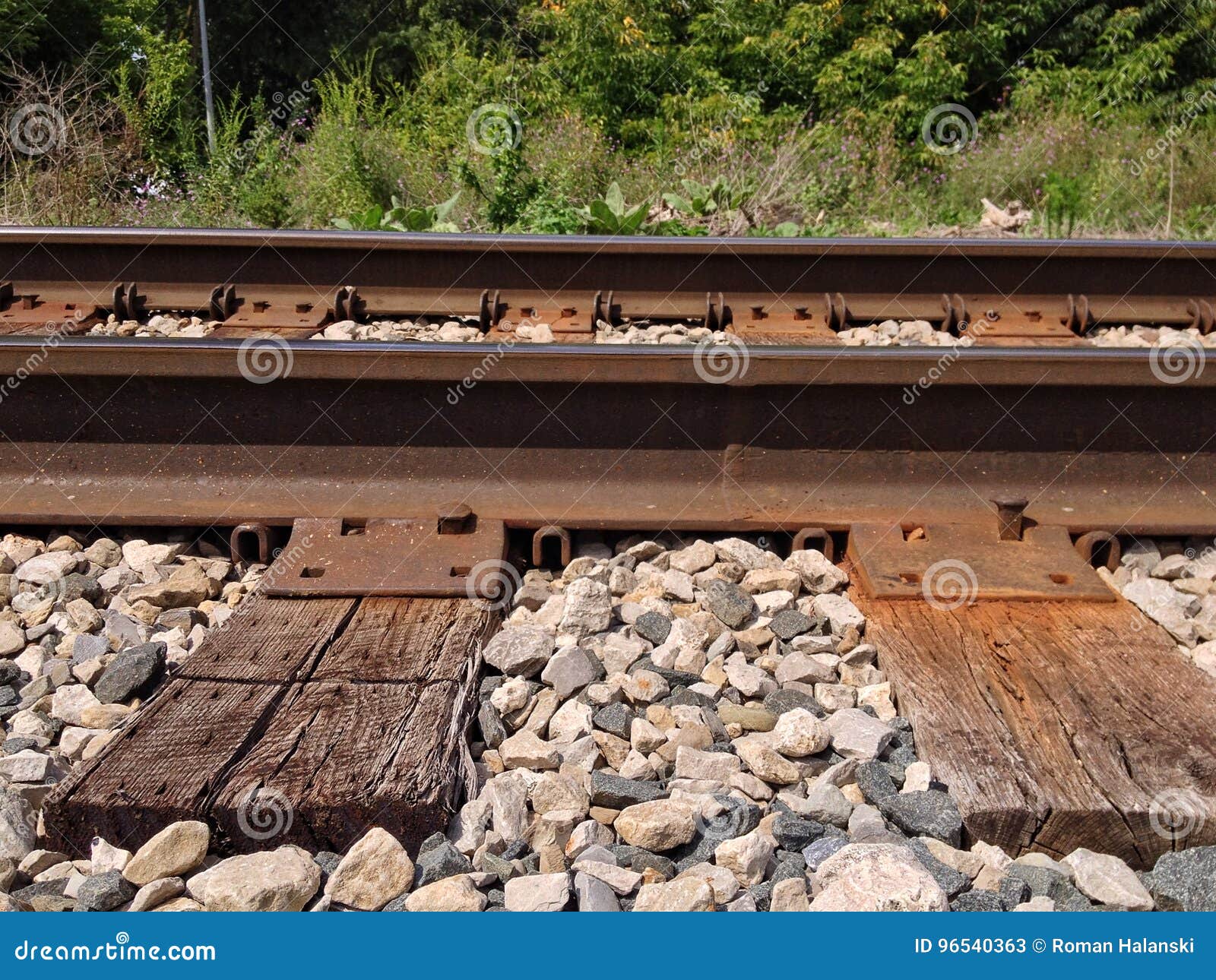 Rusty Railroad Tracks through Town Stock Image - Image of rust, ballast ...