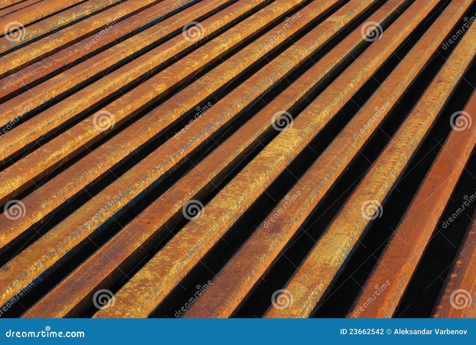 Rusty rails lined-up stock photo. Image of rusted, abstract - 23662542