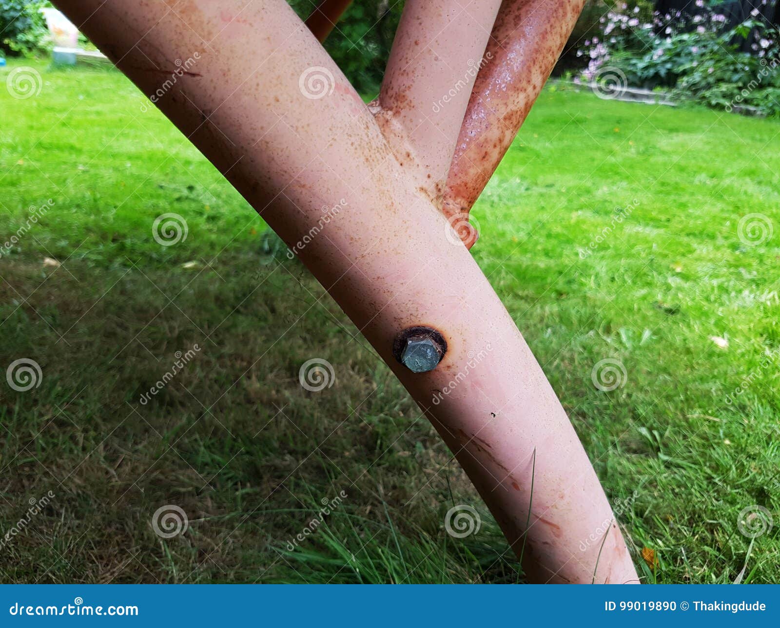 Rusty Red Metal Leg Outside Stock Photo - Image of pale, garden: 99019890