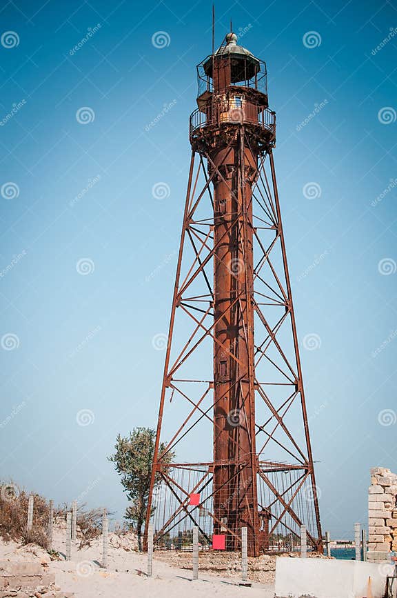 Rusty Relic: an Abandoned Lighthouse Reaching for the Sky Stock Photo ...