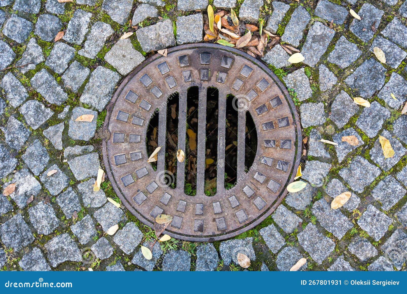 Rusty Sewer Manhole in Paving Stones, Close-up Stock Image - Image of ...