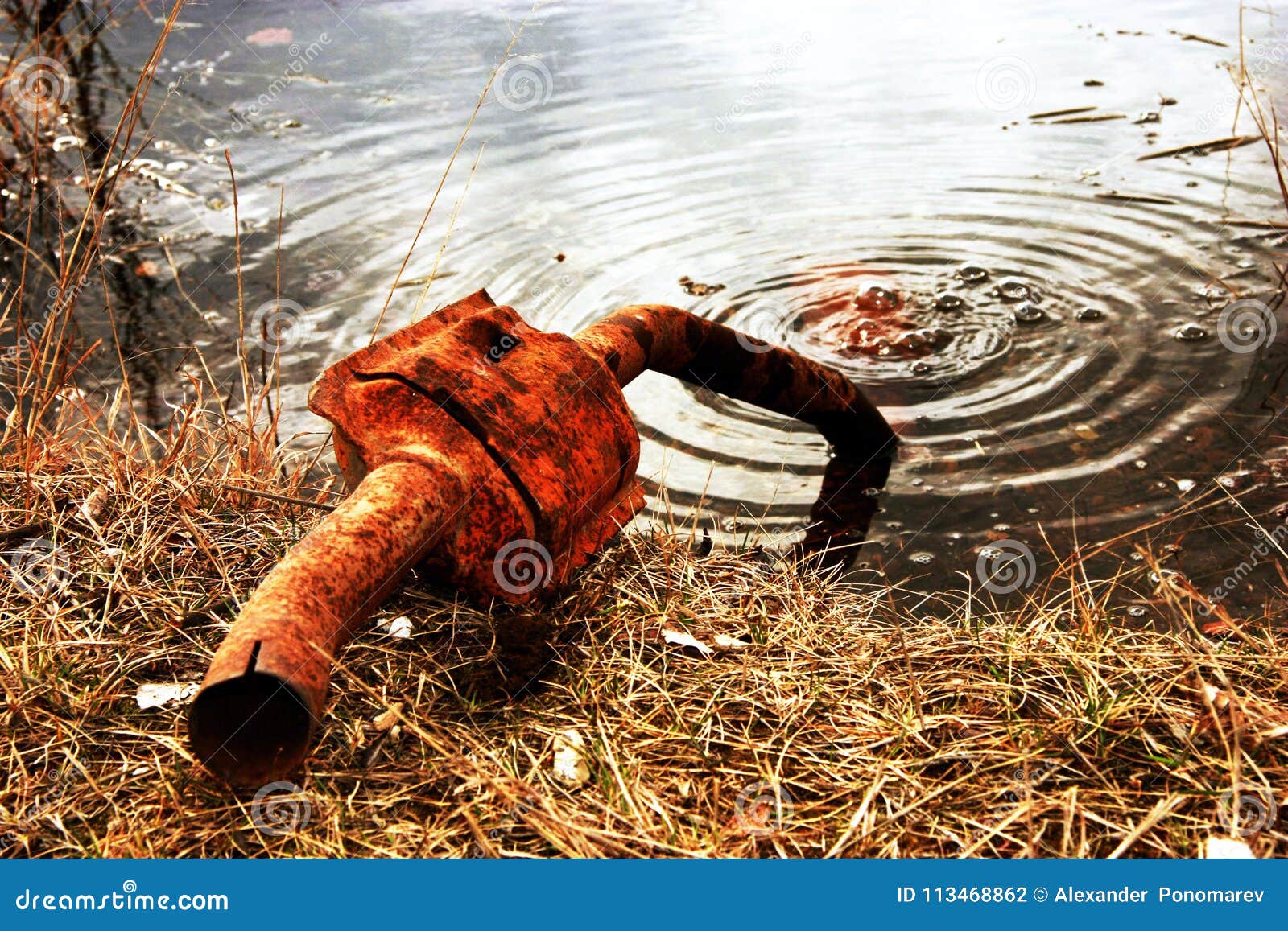 A Rusty Silencer, Thrown To Drown in a Pond. Stock Photo - Image of ...