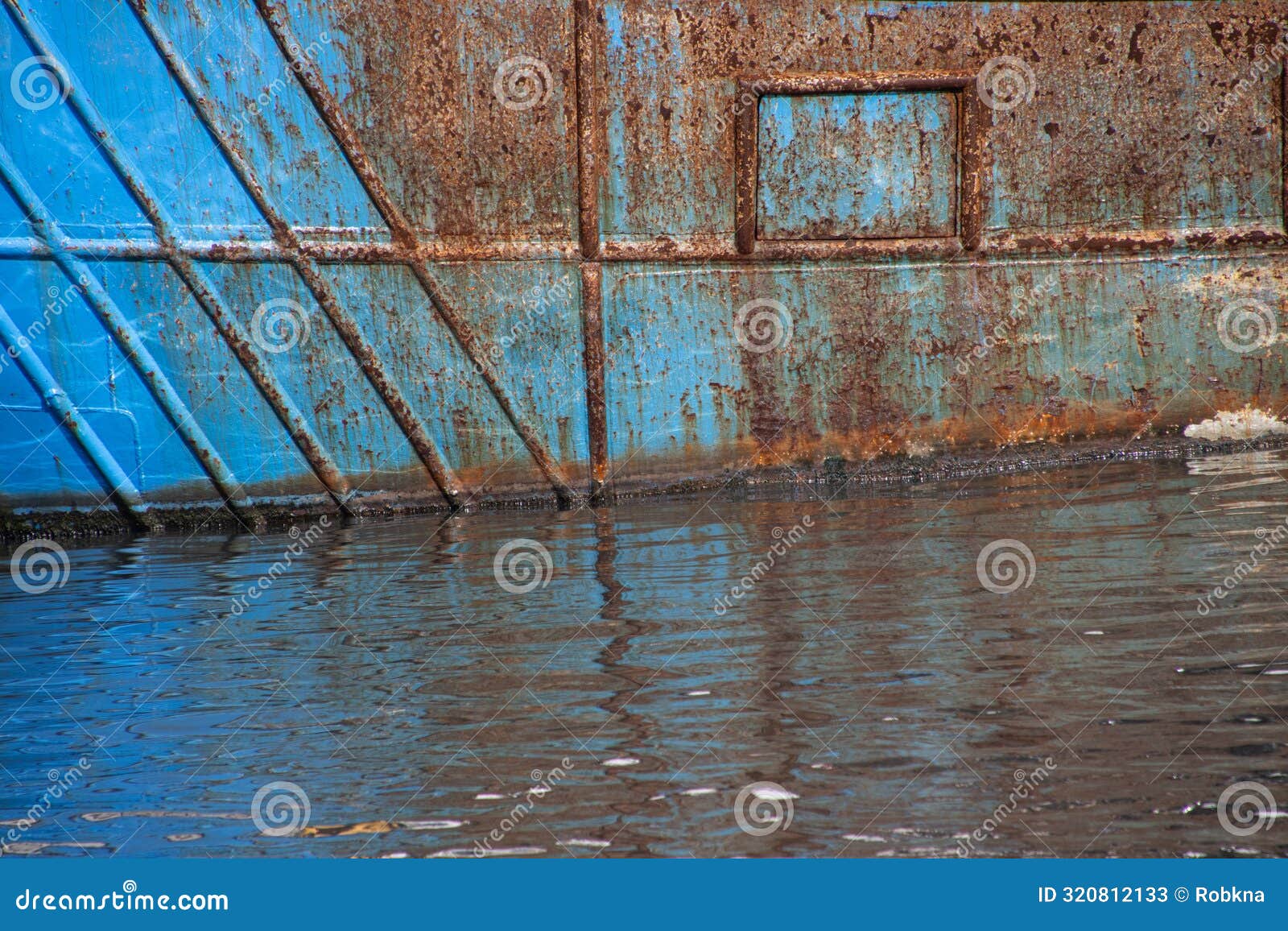 Rusty Structure on a Blue Abandoned Ship Hull in a Harbor Stock Image ...