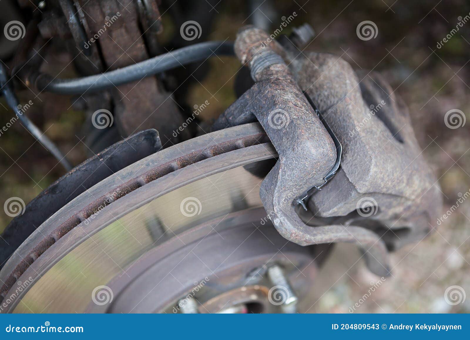 Rusty Ventilated Brake Disk with Used Brake Pads in Calliper, Close-up ...