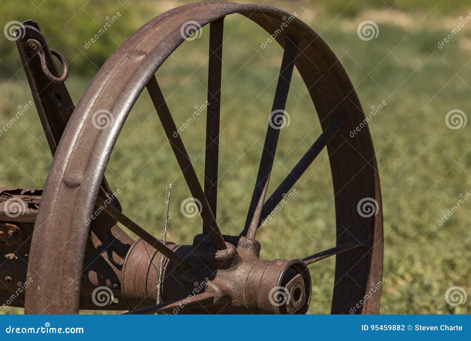 Rusty Wagon Wheel stock photo. Image of grass, historic - 95459882