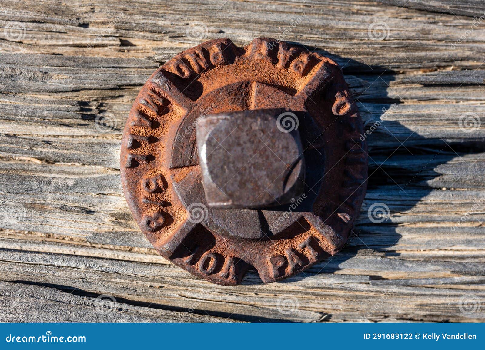 Rusty Washer with Text Stamped on it Stock Photo - Image of lumber ...