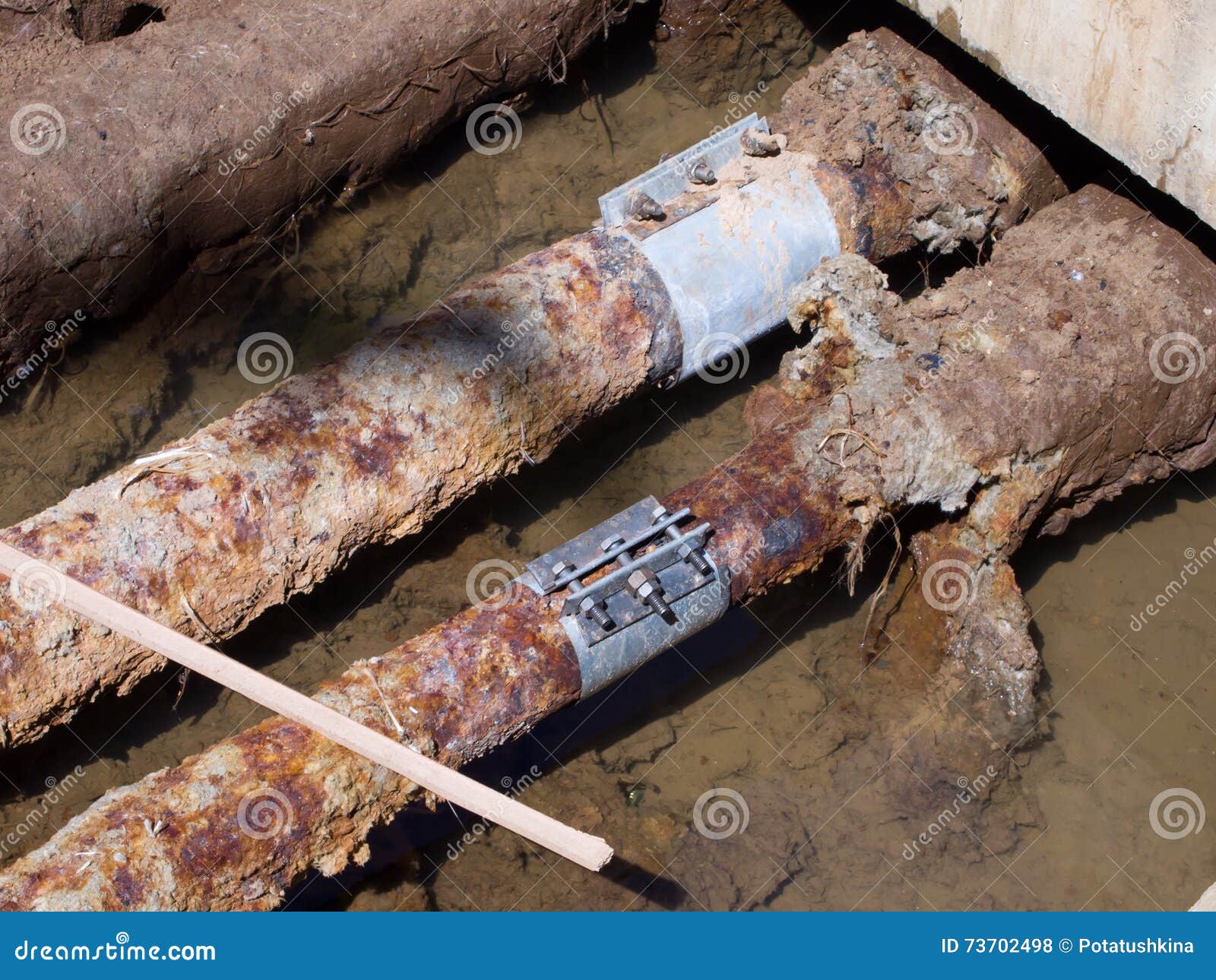 Rusty Water Pipes with Embedded Holes Stock Photo - Image of iron ...