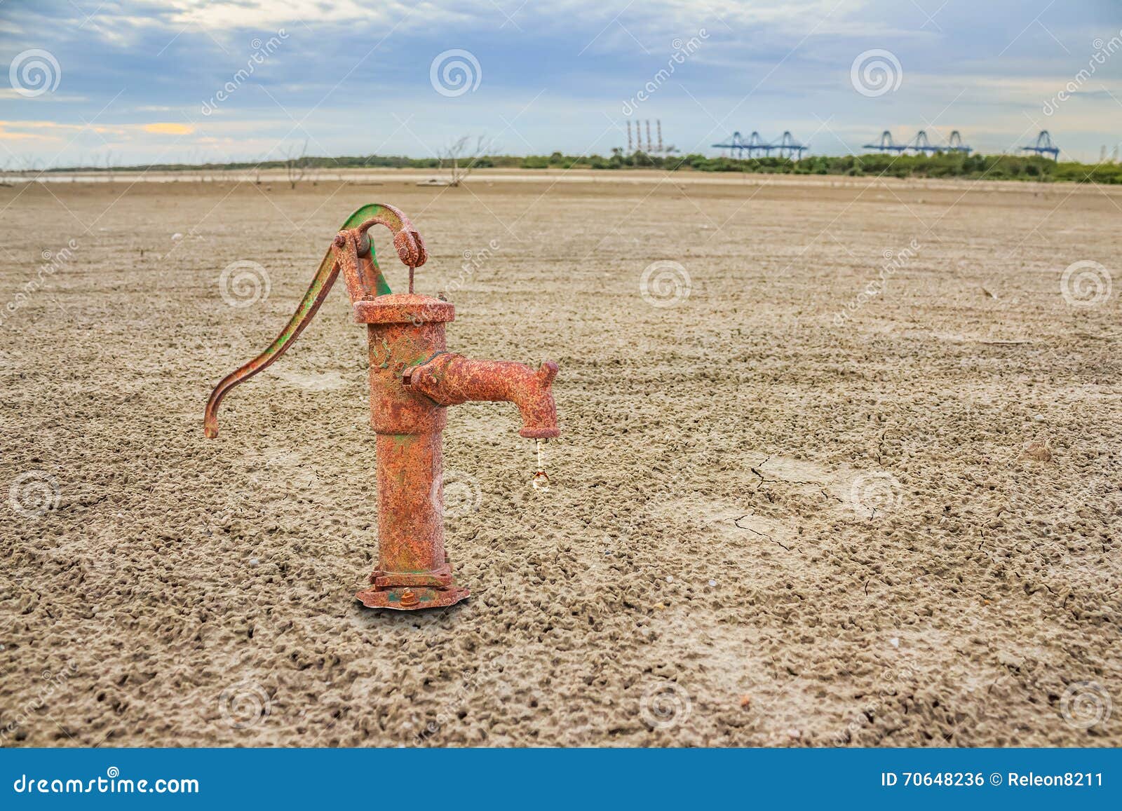 Rusty water pump on land. stock photo. Image of damaged - 70648236