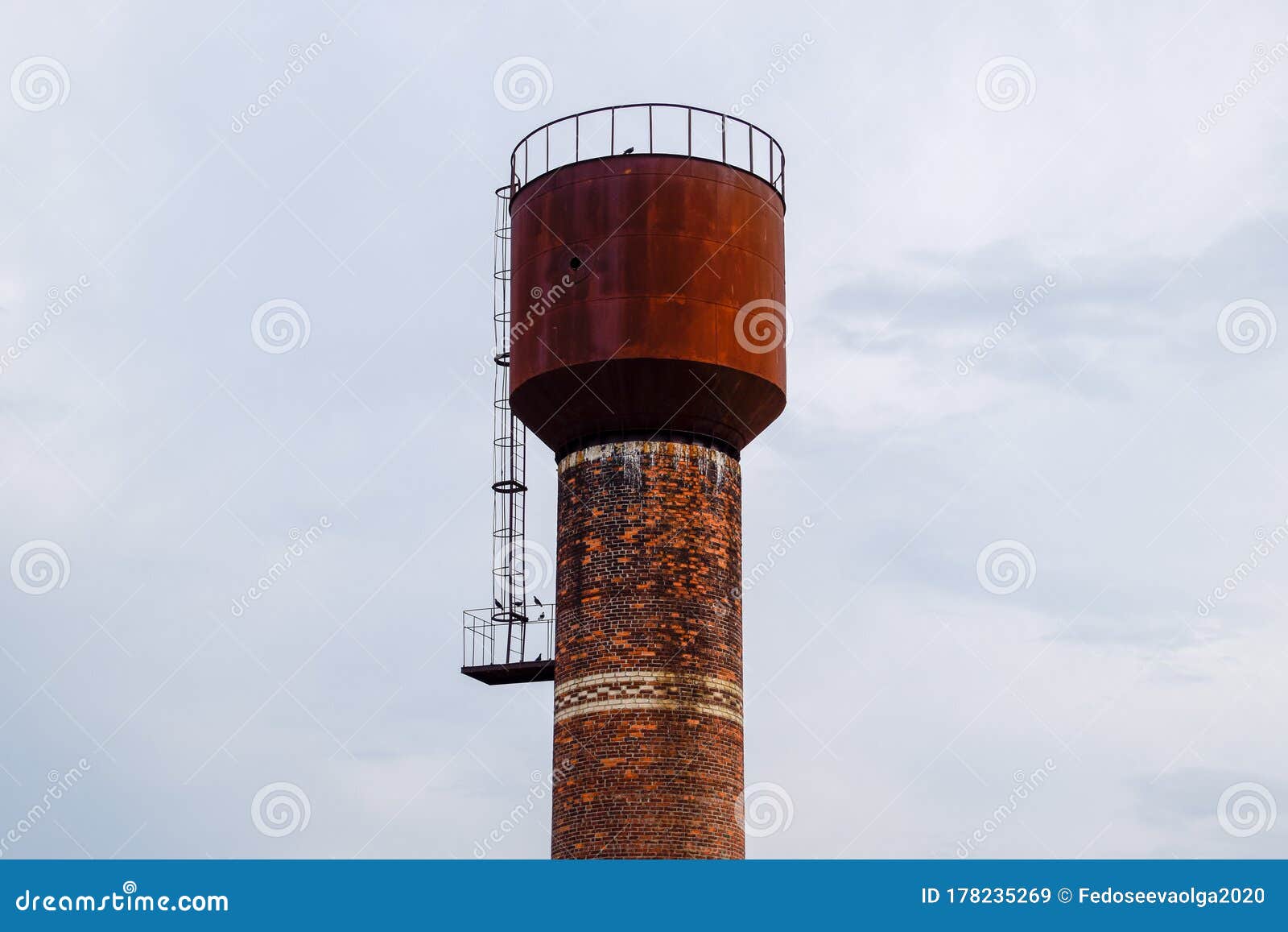 Rusty Water Tower Against Sky. Old Water Pump Stock Image - Image of ...