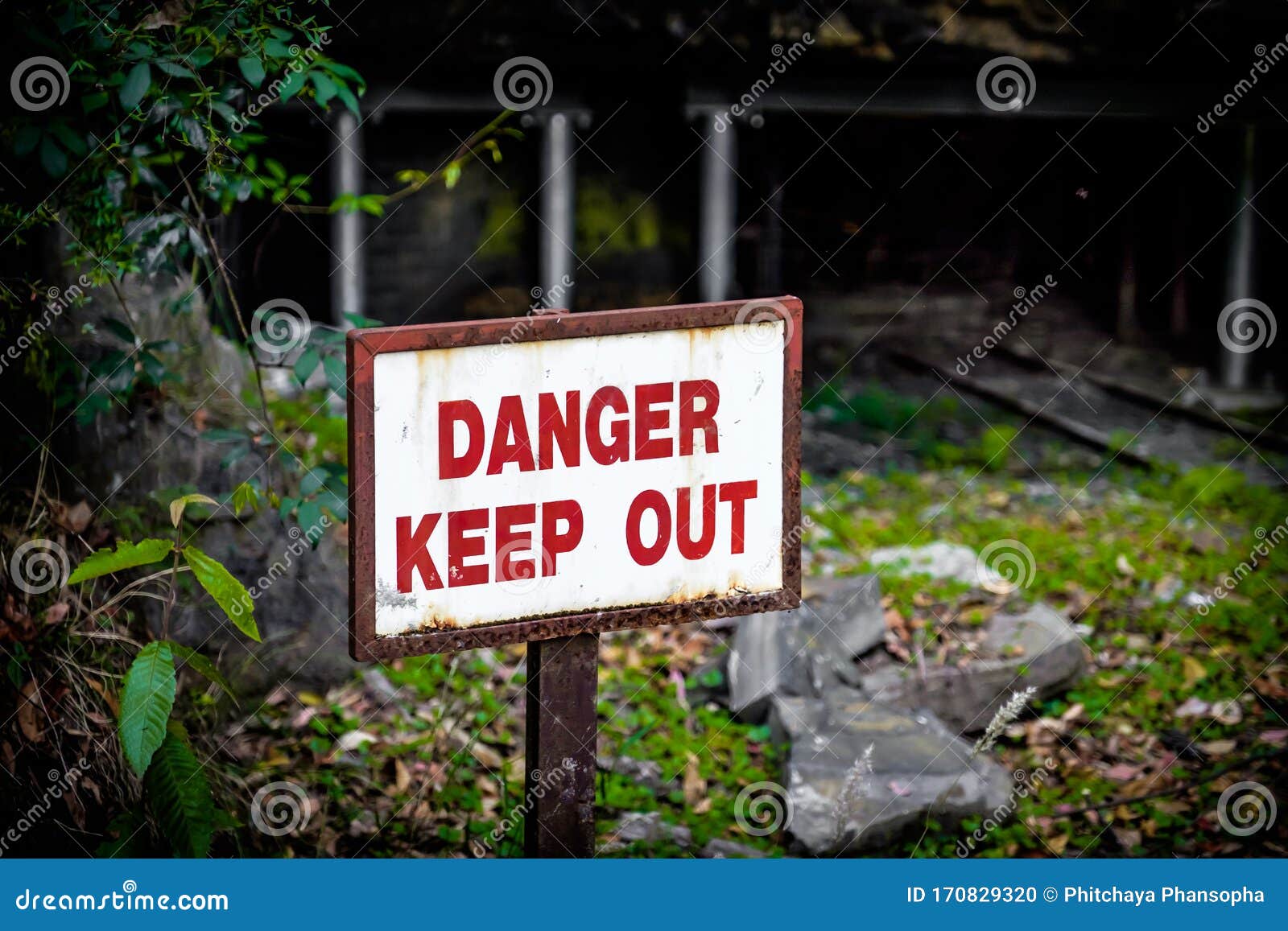 A Rusty White Danger Keep Out Sign with a Rusty Pole Stock Photo ...