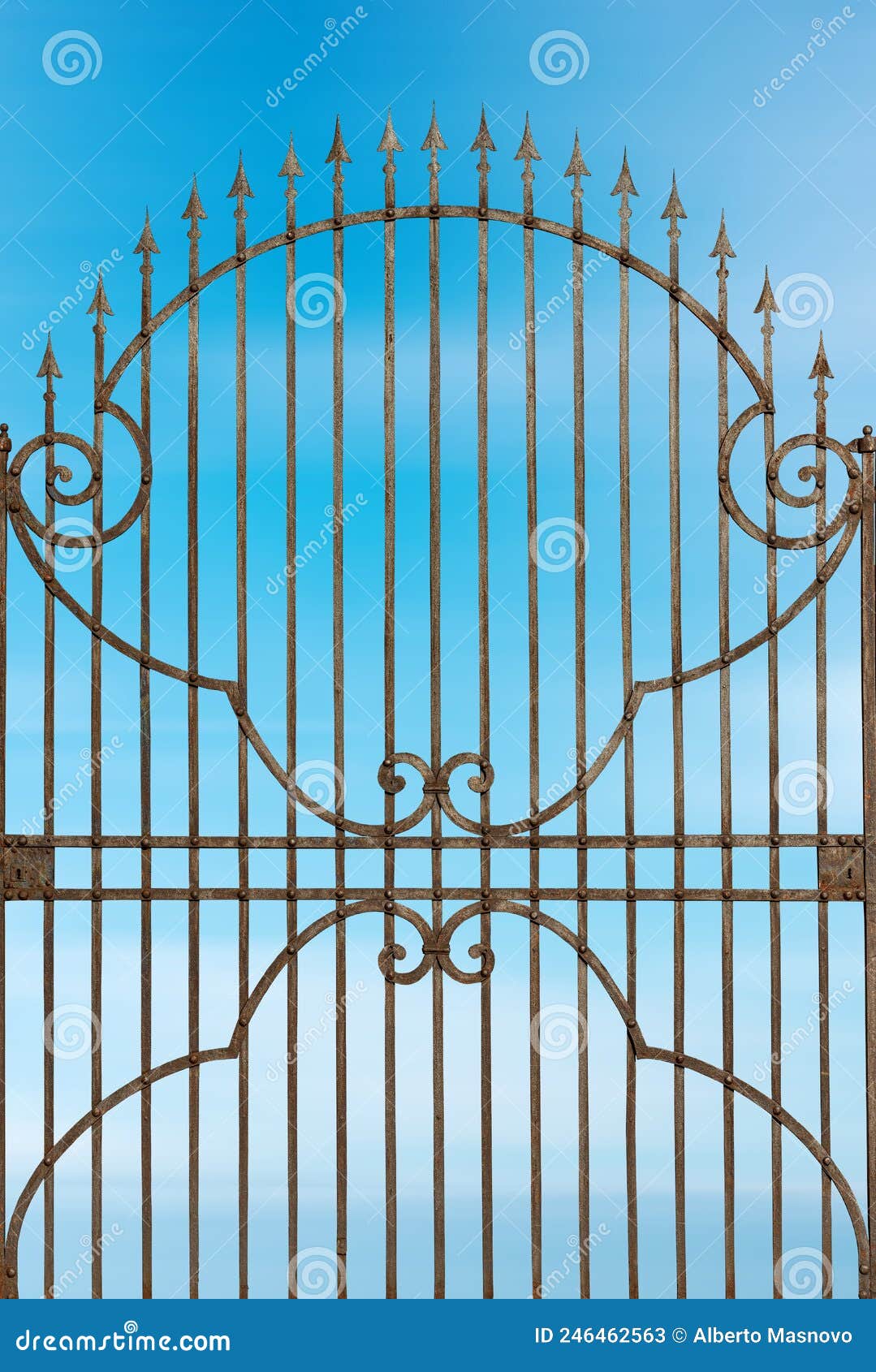 Rusty Wrought Iron Gate with Sharp Points on Blue Sky with Clouds Stock ...
