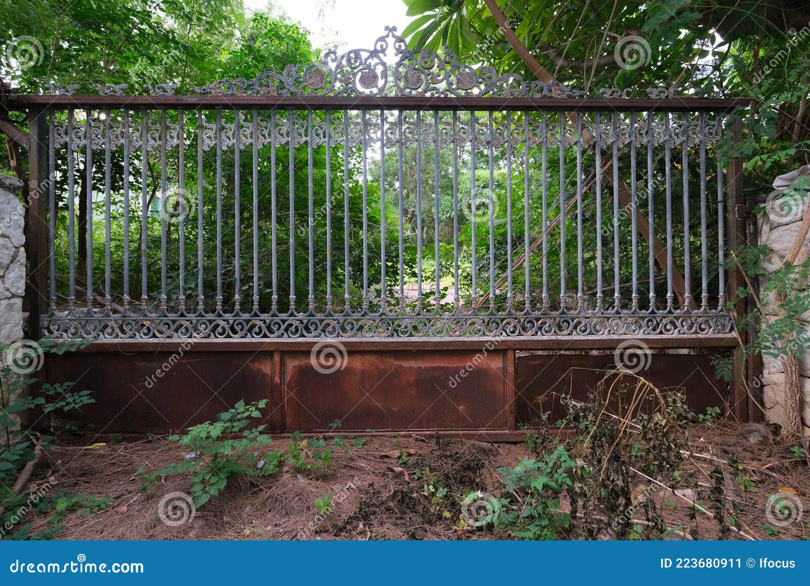 Rusty Wrought Iron Gate between Stone Columns Stock Image - Image of ...