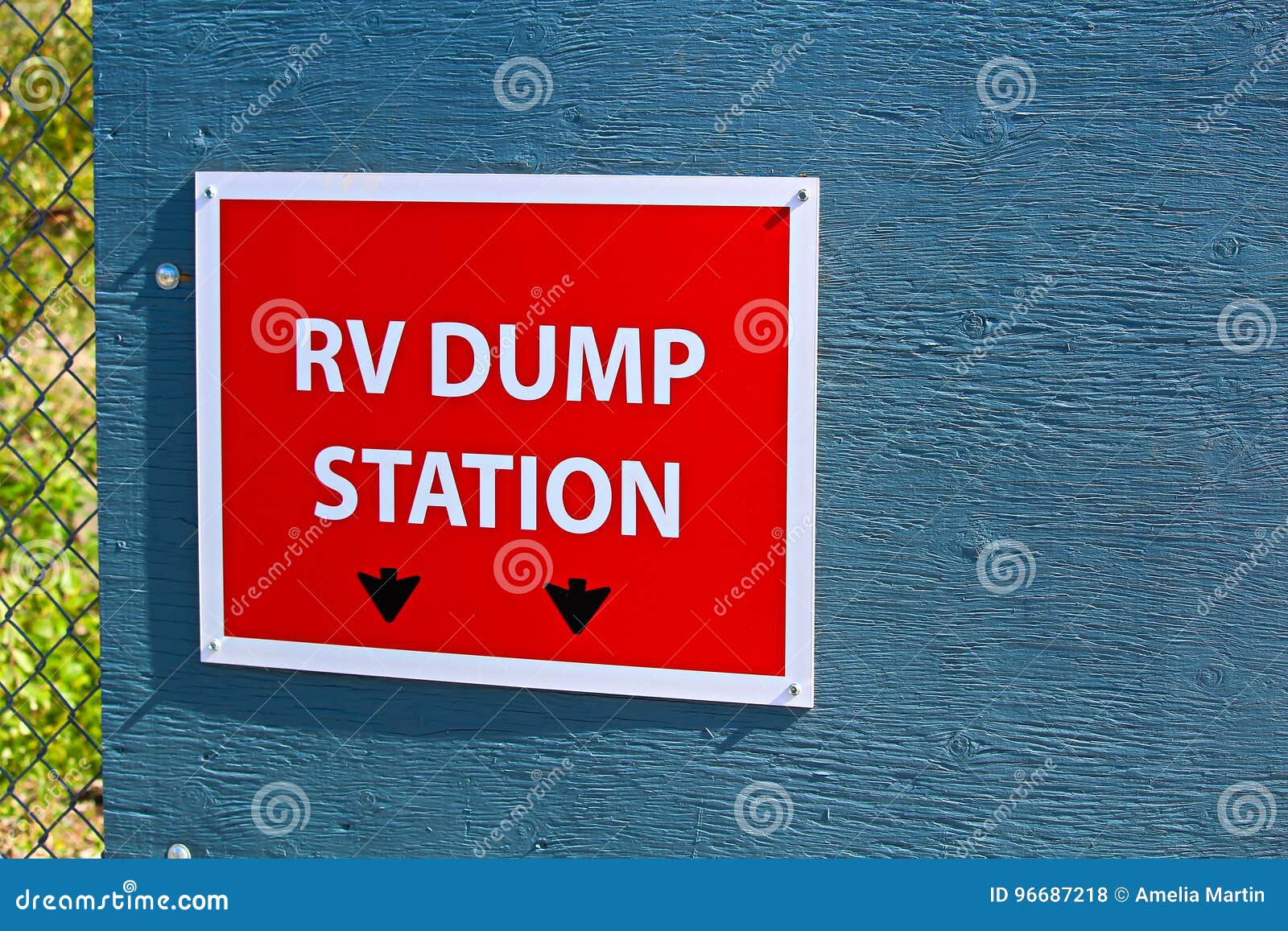 An RV Dump Station Sign on the Edge of a Building Stock Photo - Image ...