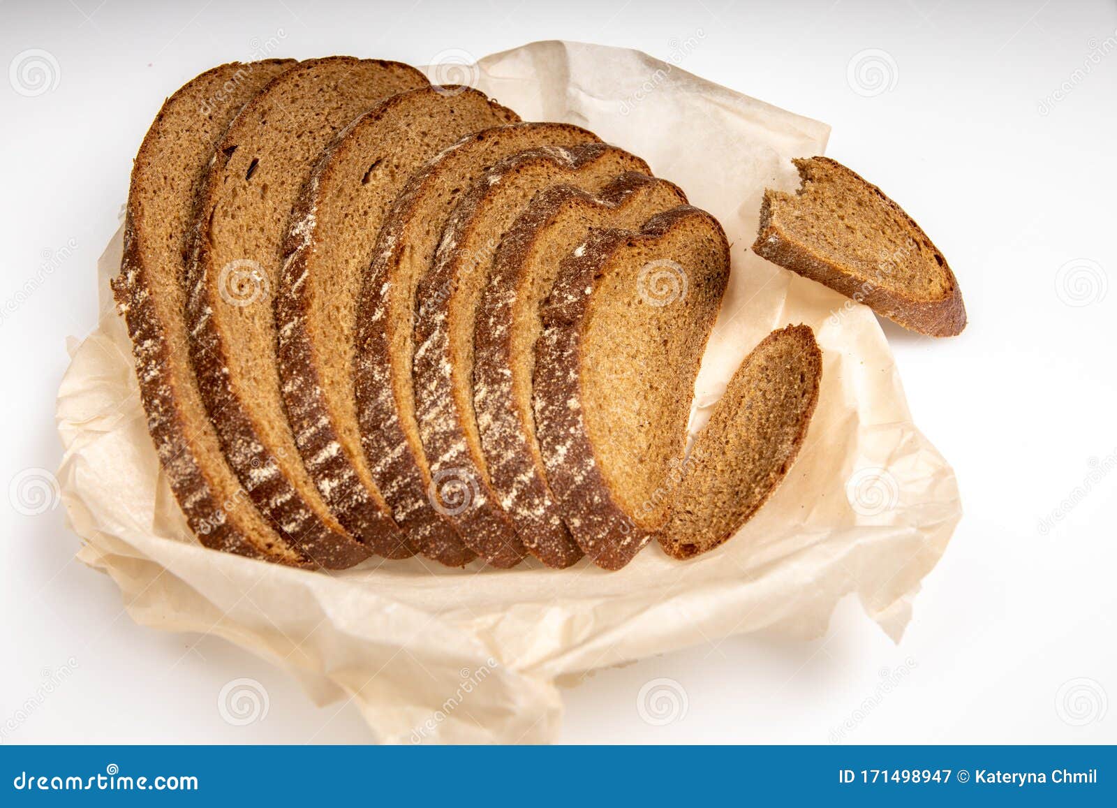 Rye Bread Cut in Pieces Lying on the Baking Paper on a White Background ...