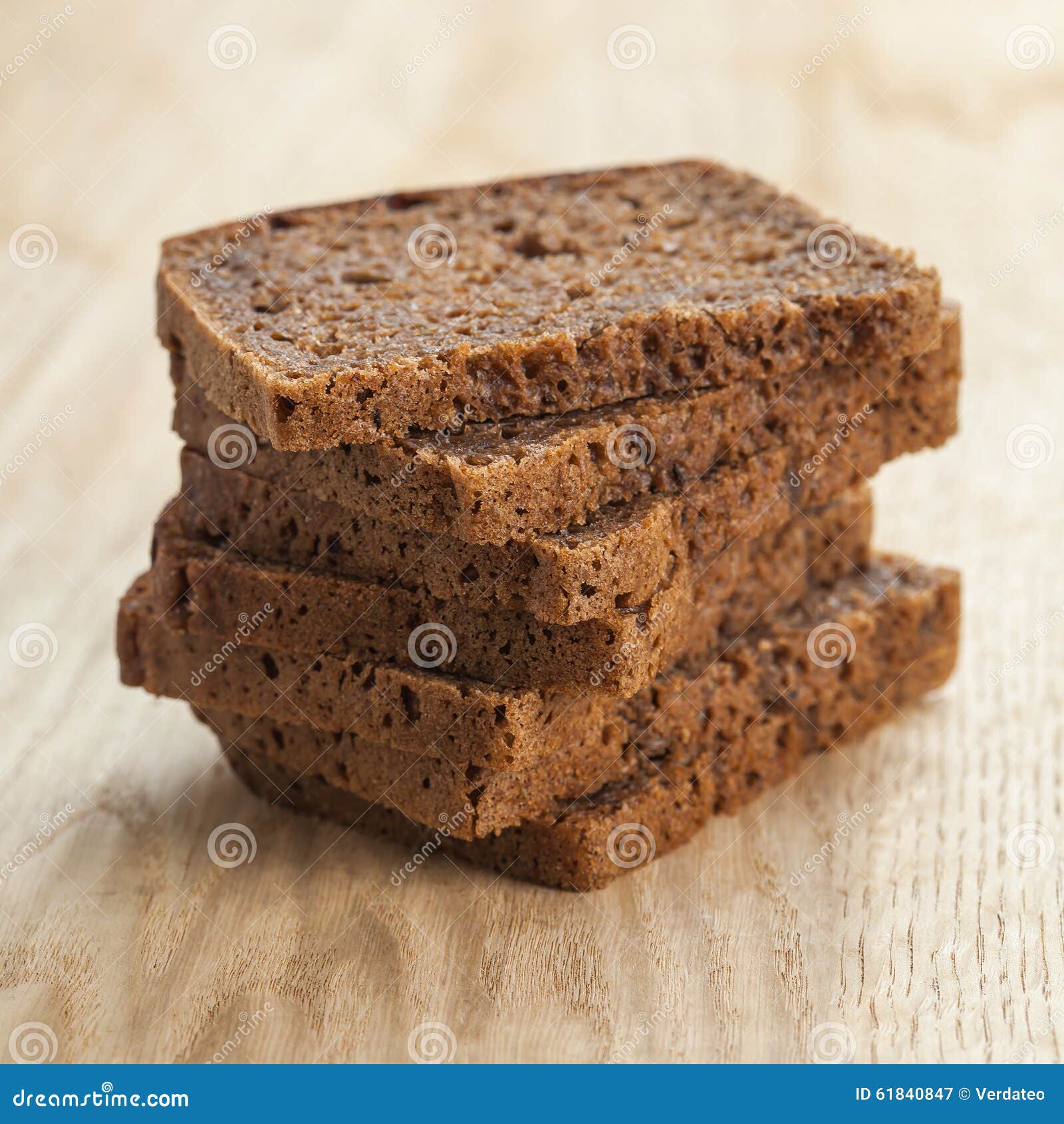 Rye bread slices on table stock image. Image of wood - 61840847