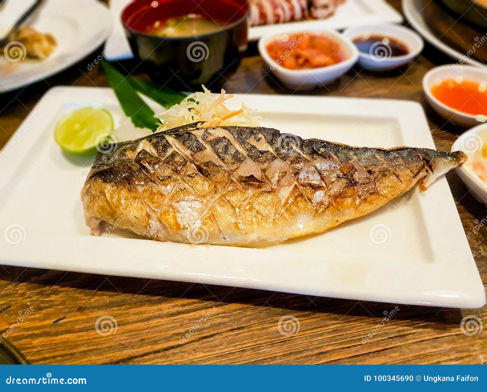 Saba fish grilled. stock photo. Image of sliced, lemon - 100345690