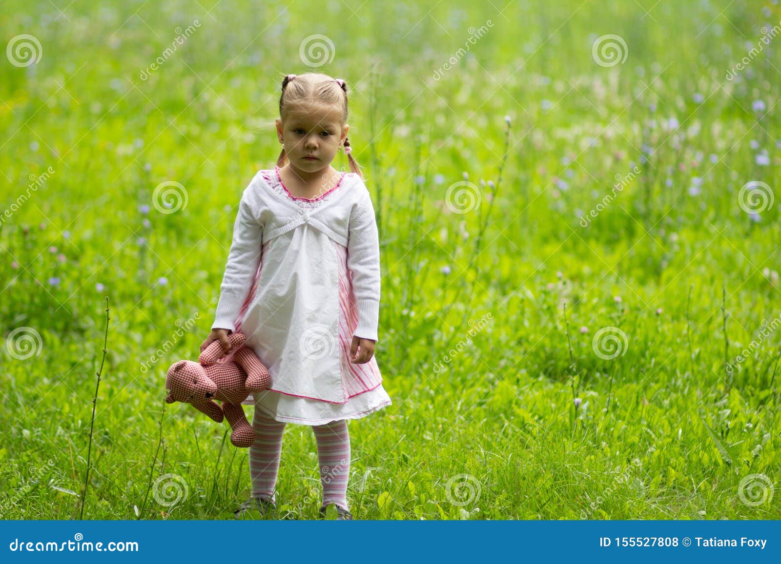 Sad Alone Child with Toy Standing in the Summer Park Stock Photo ...