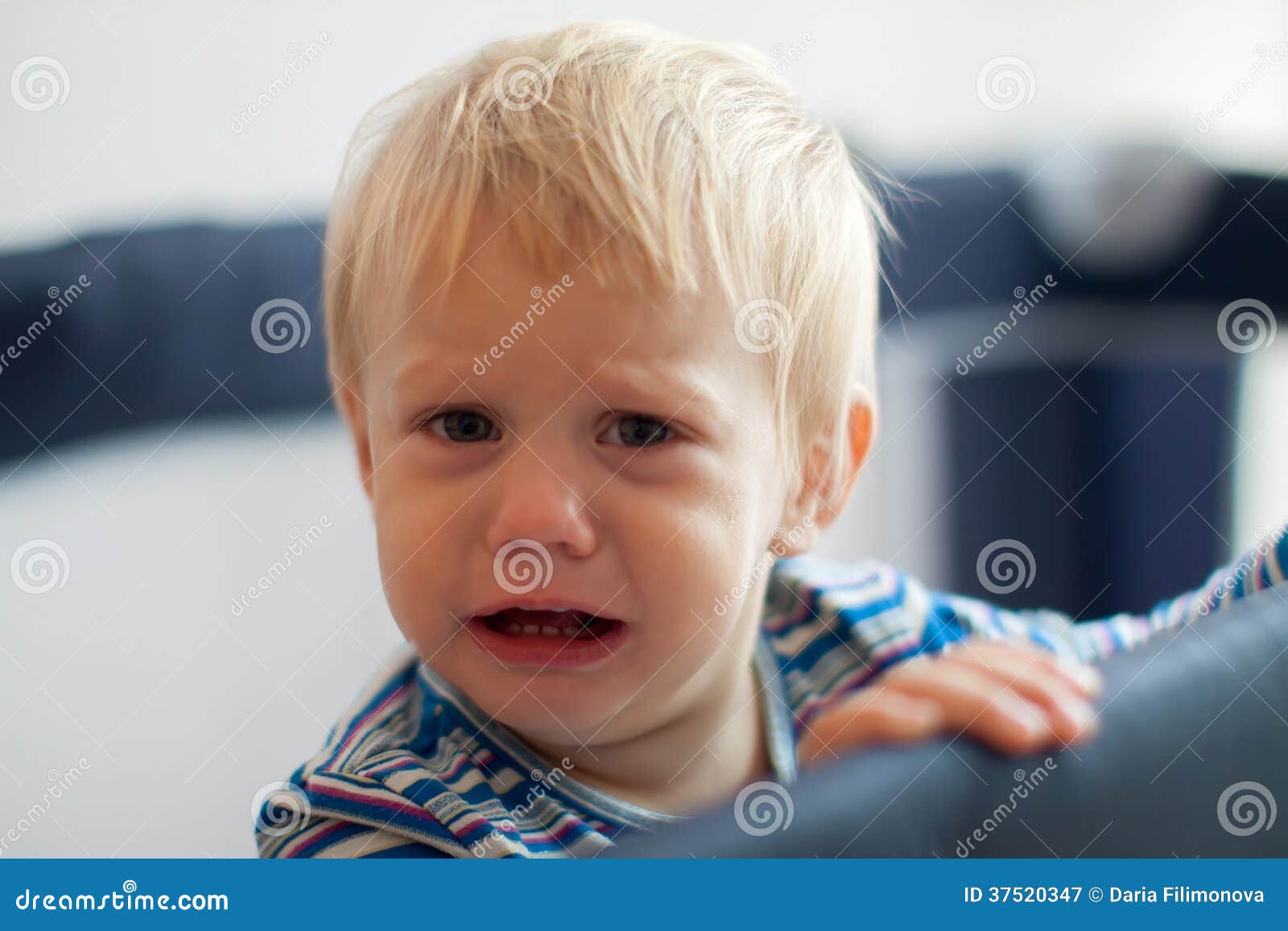 Sad baby in the crib stock image. Image of young, child - 37520347