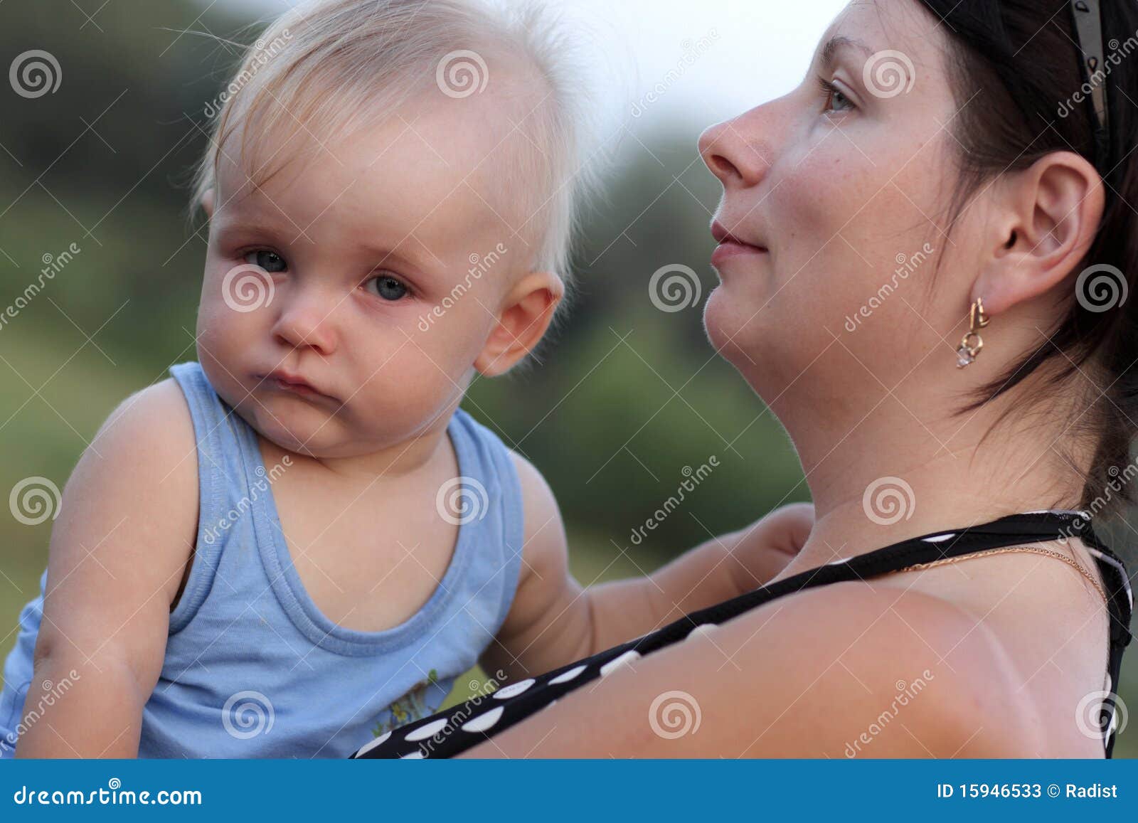 Sad baby with her mother stock image. Image of child - 15946533