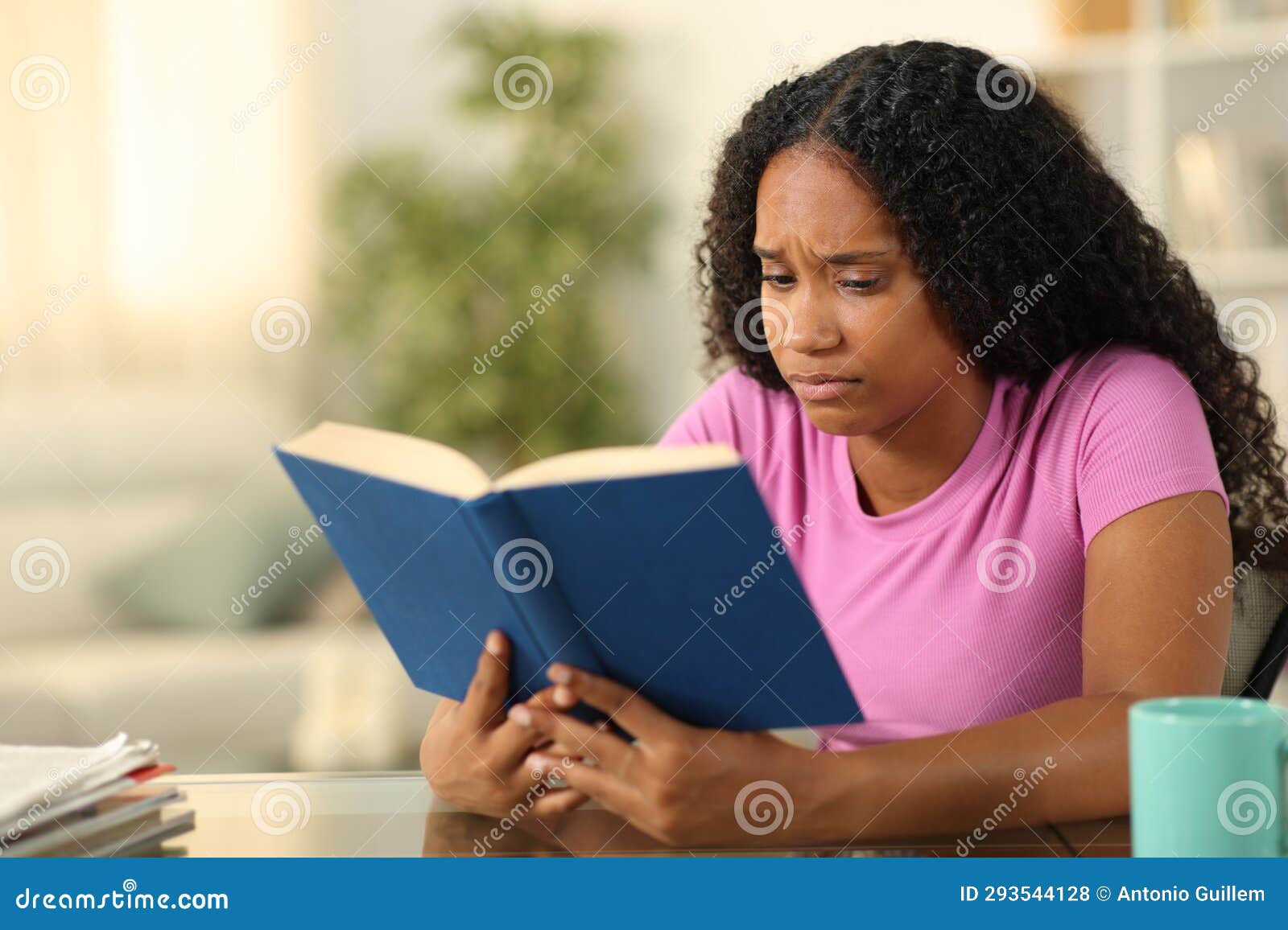 Sad Black Woman Reading a Book at Home Stock Photo - Image of immersive ...