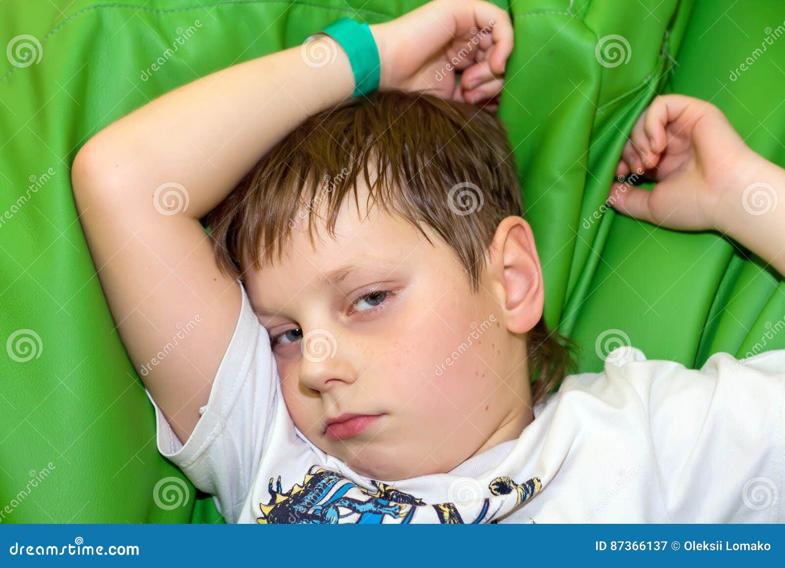 Sad Boy on a Green Couch Hurt Him Stock Image - Image of sadness, upset ...