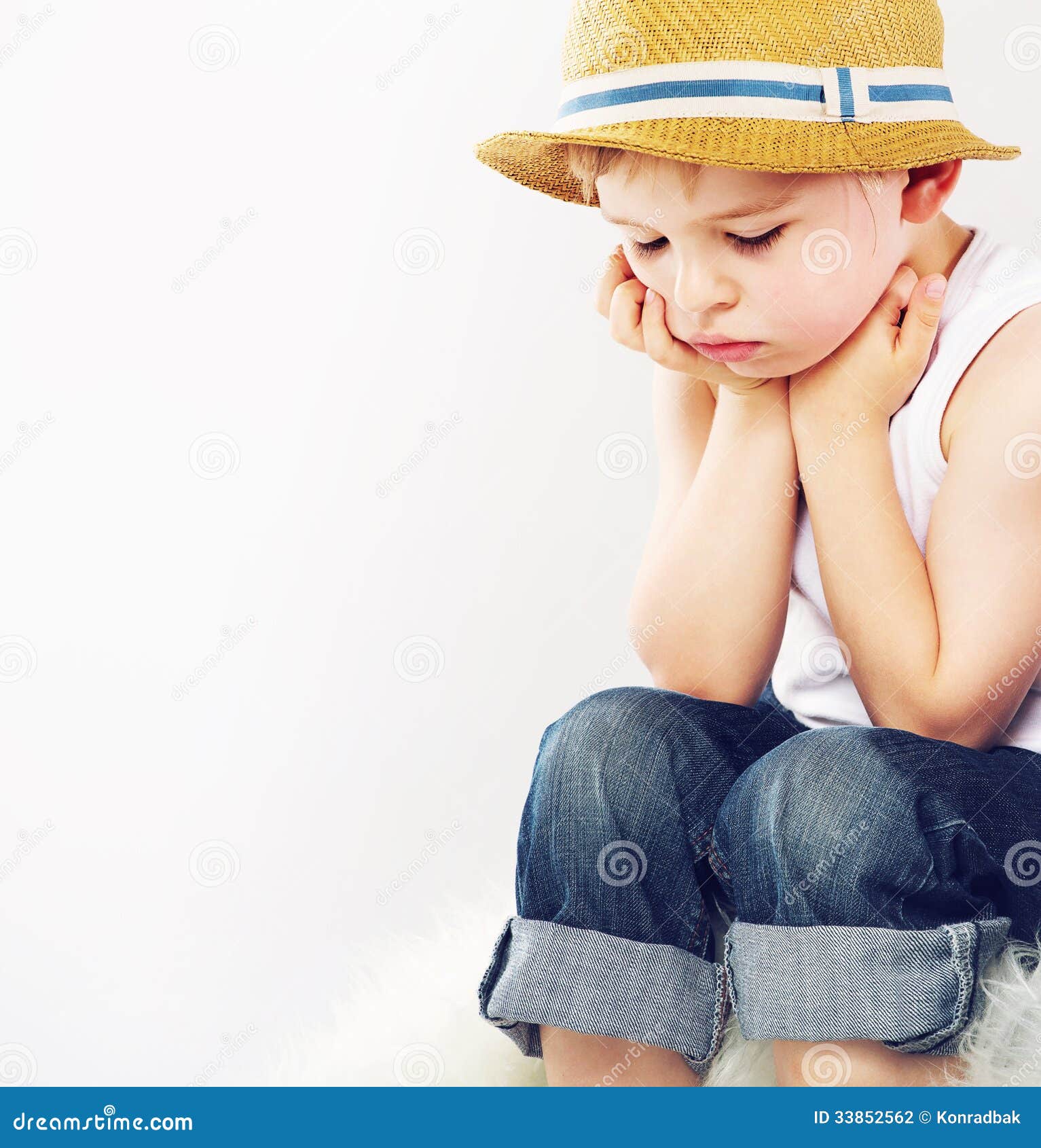 Sad boy with his straw hat stock photo. Image of child - 33852562