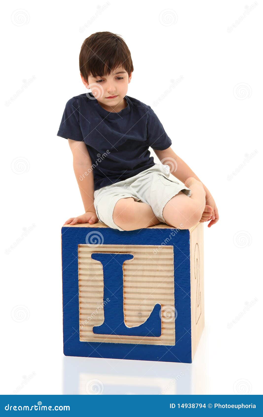 Sad Boy on Letter L stock photo. Image of wooden, blue - 14938794