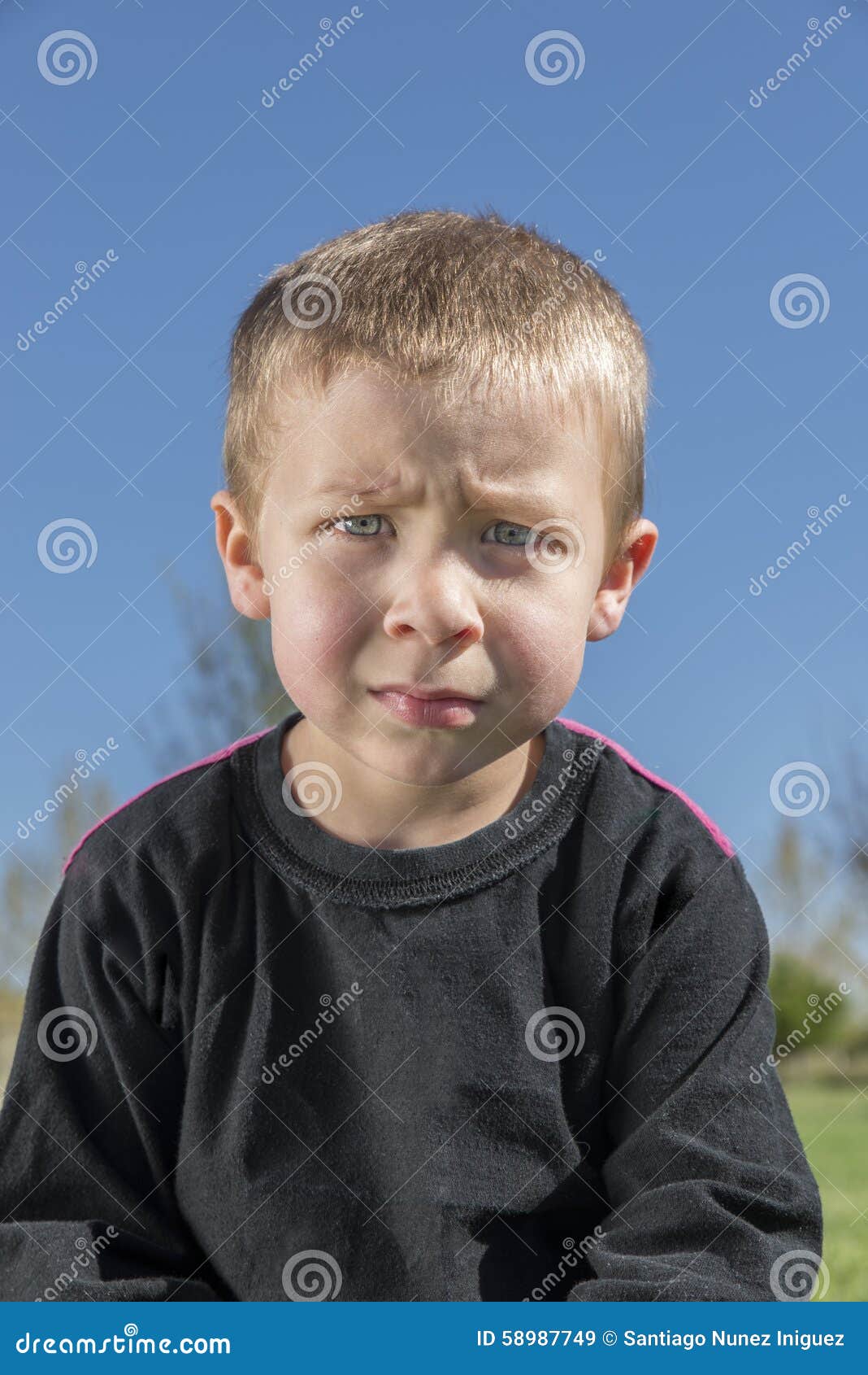 Sad boy looking at camera stock image. Image of angry - 58987749