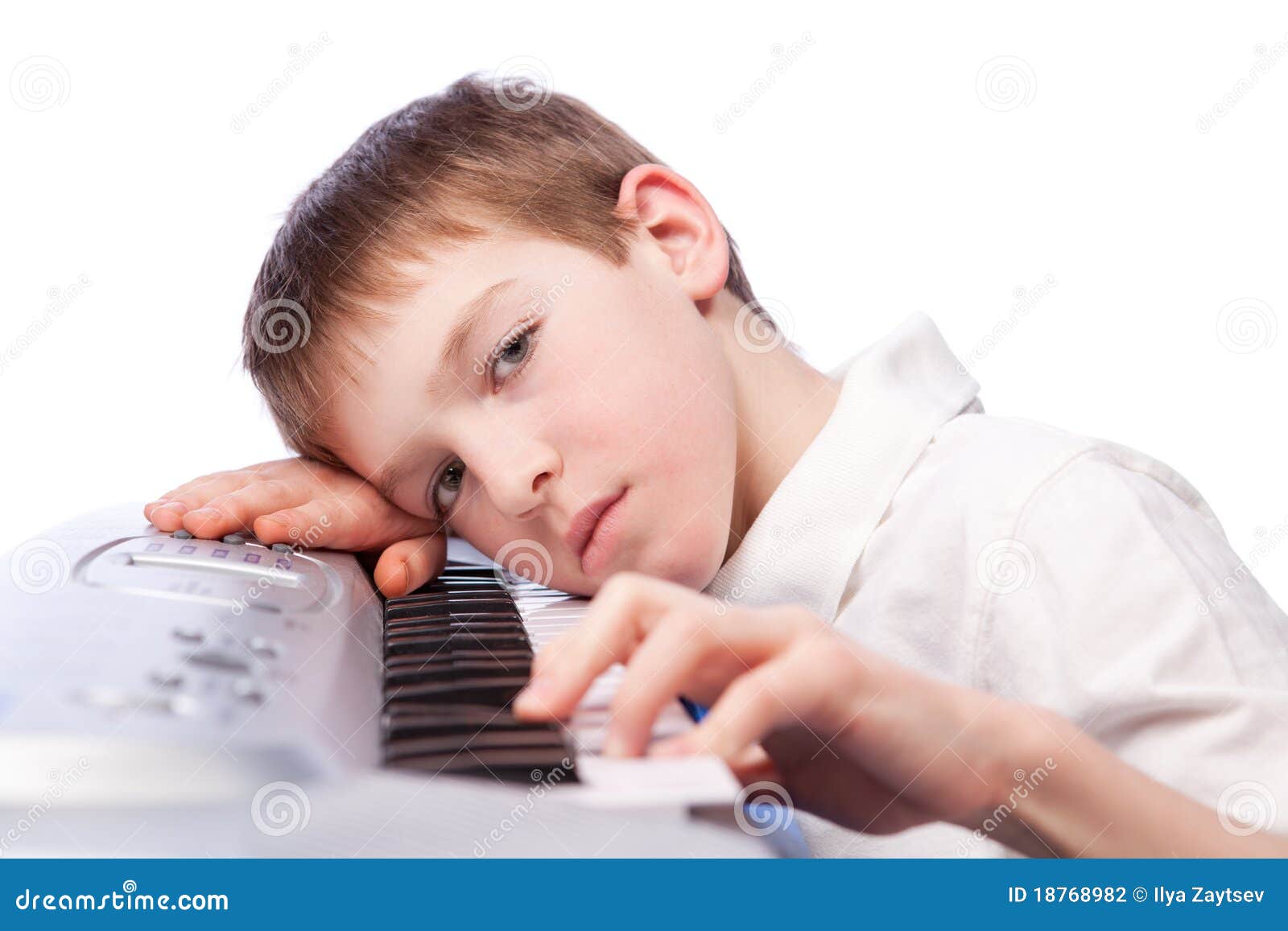 Sad boy plays piano stock photo. Image of caucasian, limb - 18768982