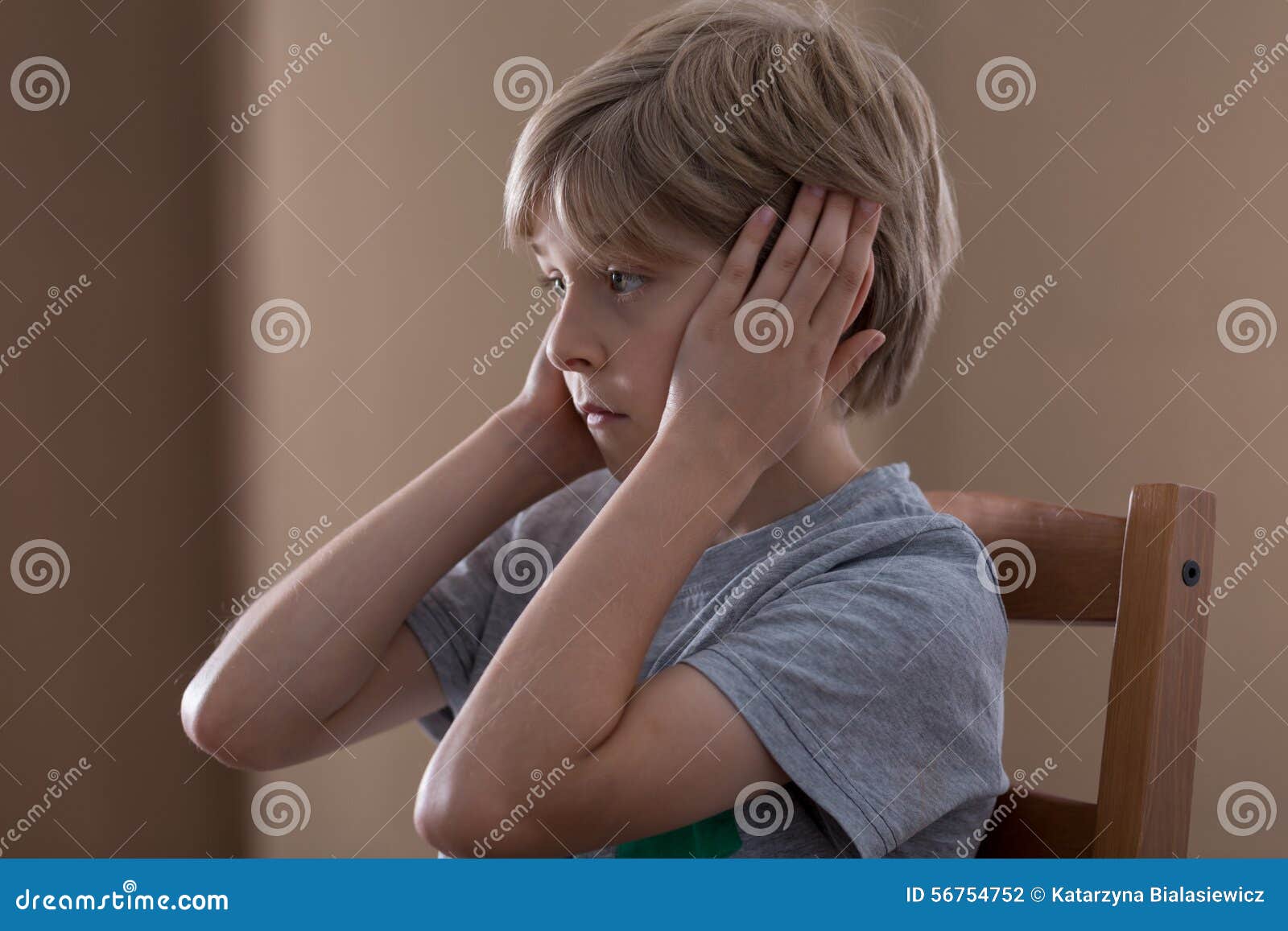 Sad boy plugging ears stock photo. Image of plugging - 56754752