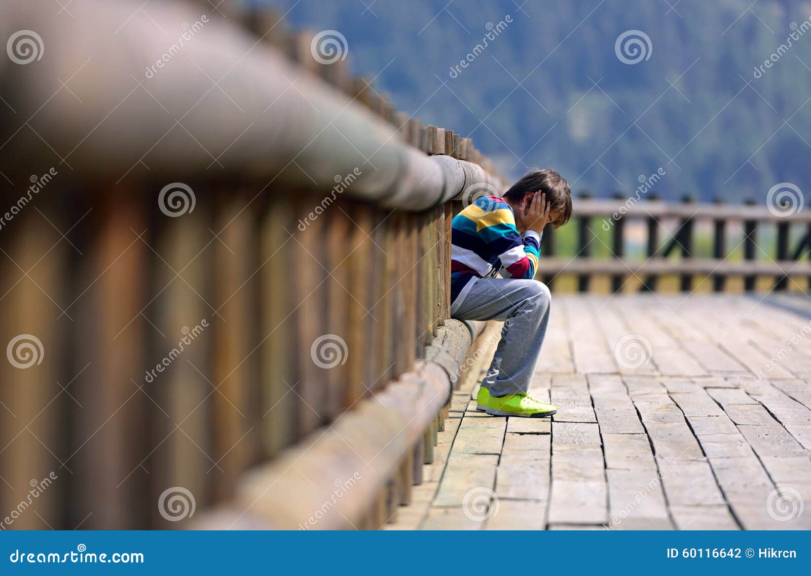 Sad boy sitting alone stock photo. Image of homeless - 60116642