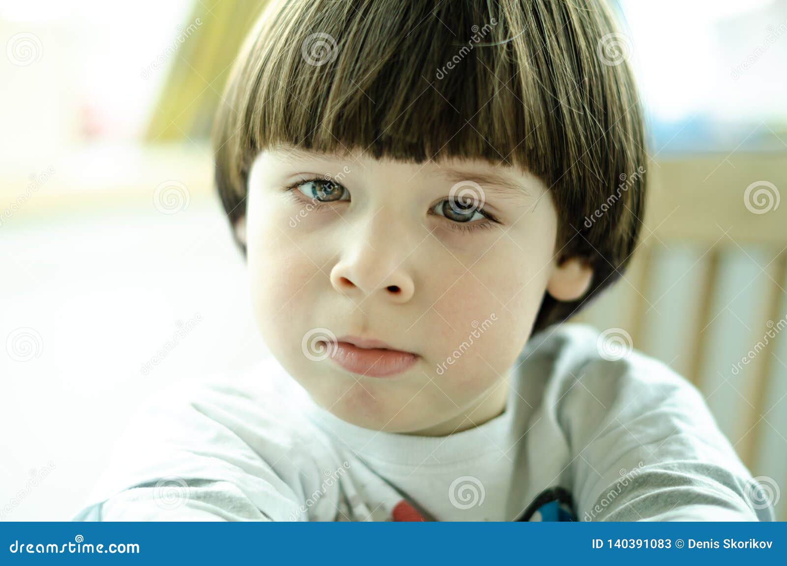 Sad Boy is Sitting and Looking into the Distance Stock Image - Image of ...