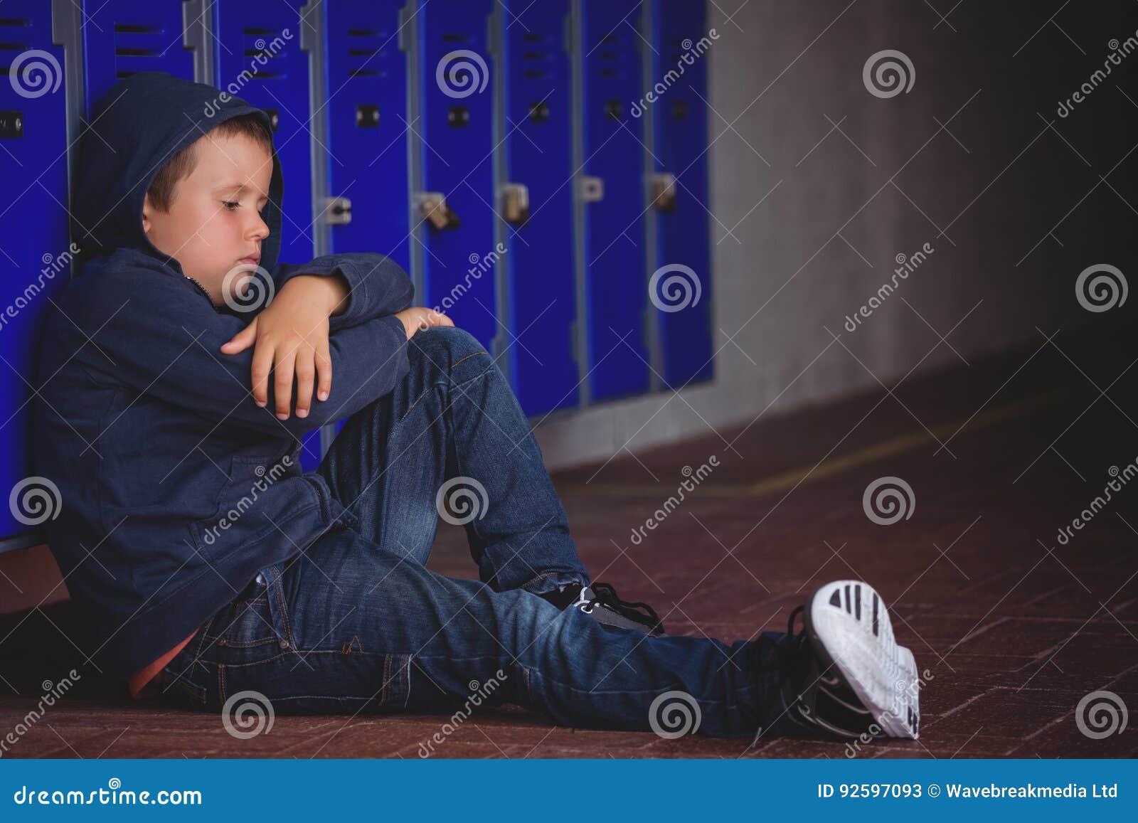 Sad Boy Sitting on Pavement by Lockers Stock Image - Image of isolation ...