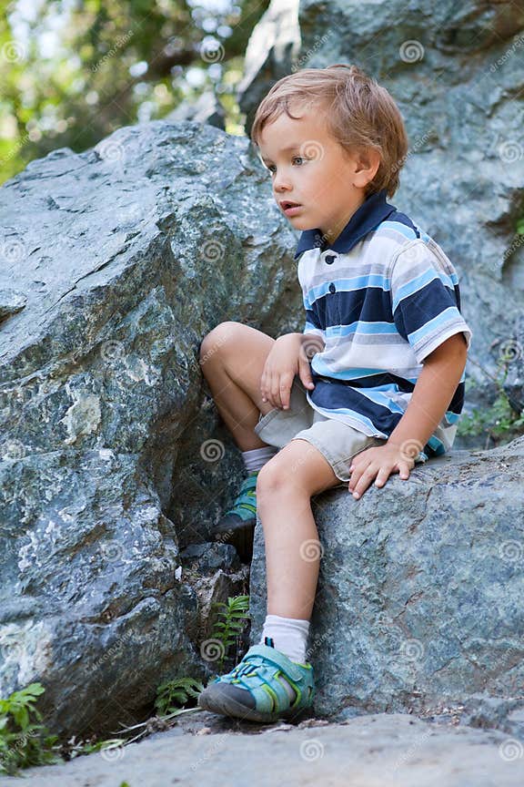 Sad boy sitting on rock. stock image. Image of walk, human - 20576147