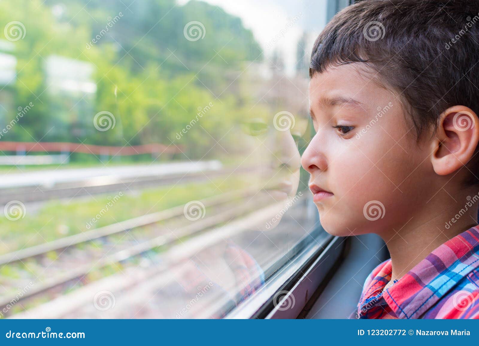 Sad boy on a train stock photo. Image of journey, looking - 123202772