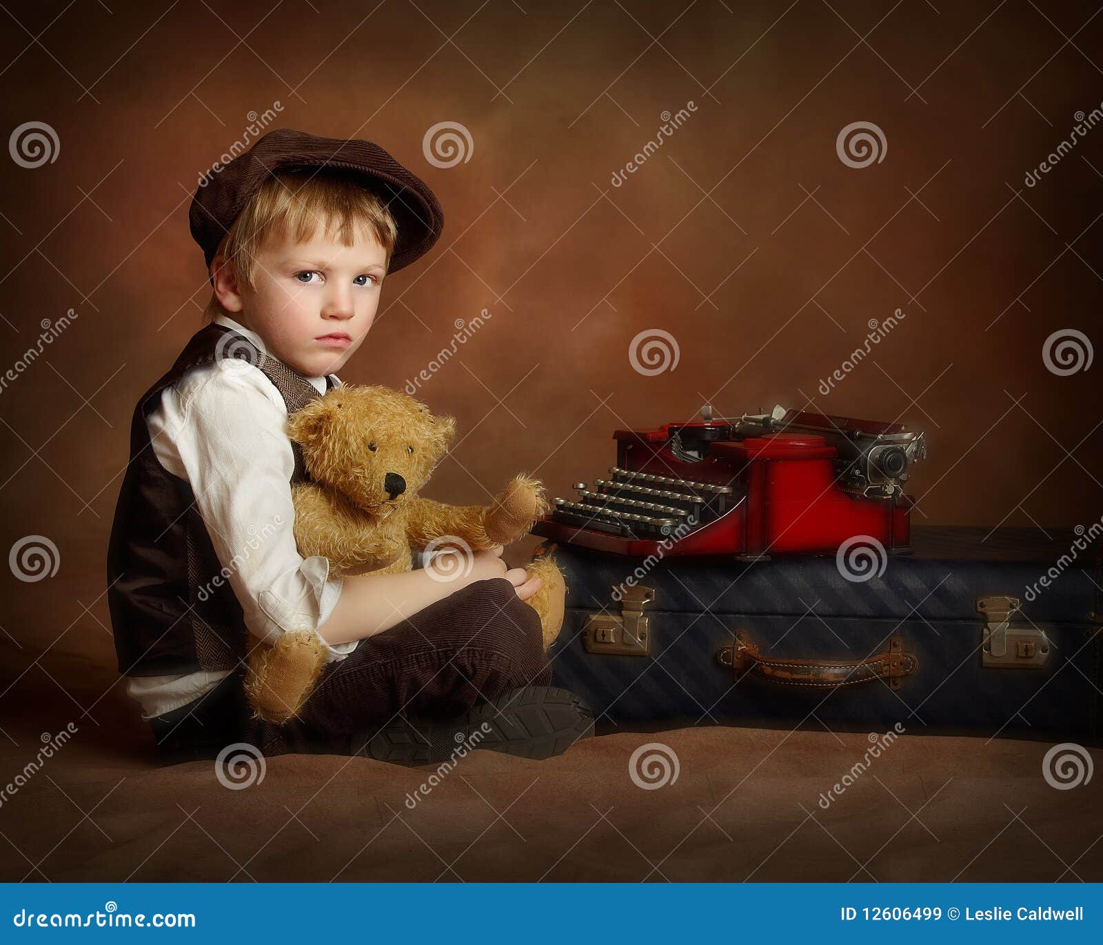 Sad boy typing with bear stock image. Image of clothing - 12606499