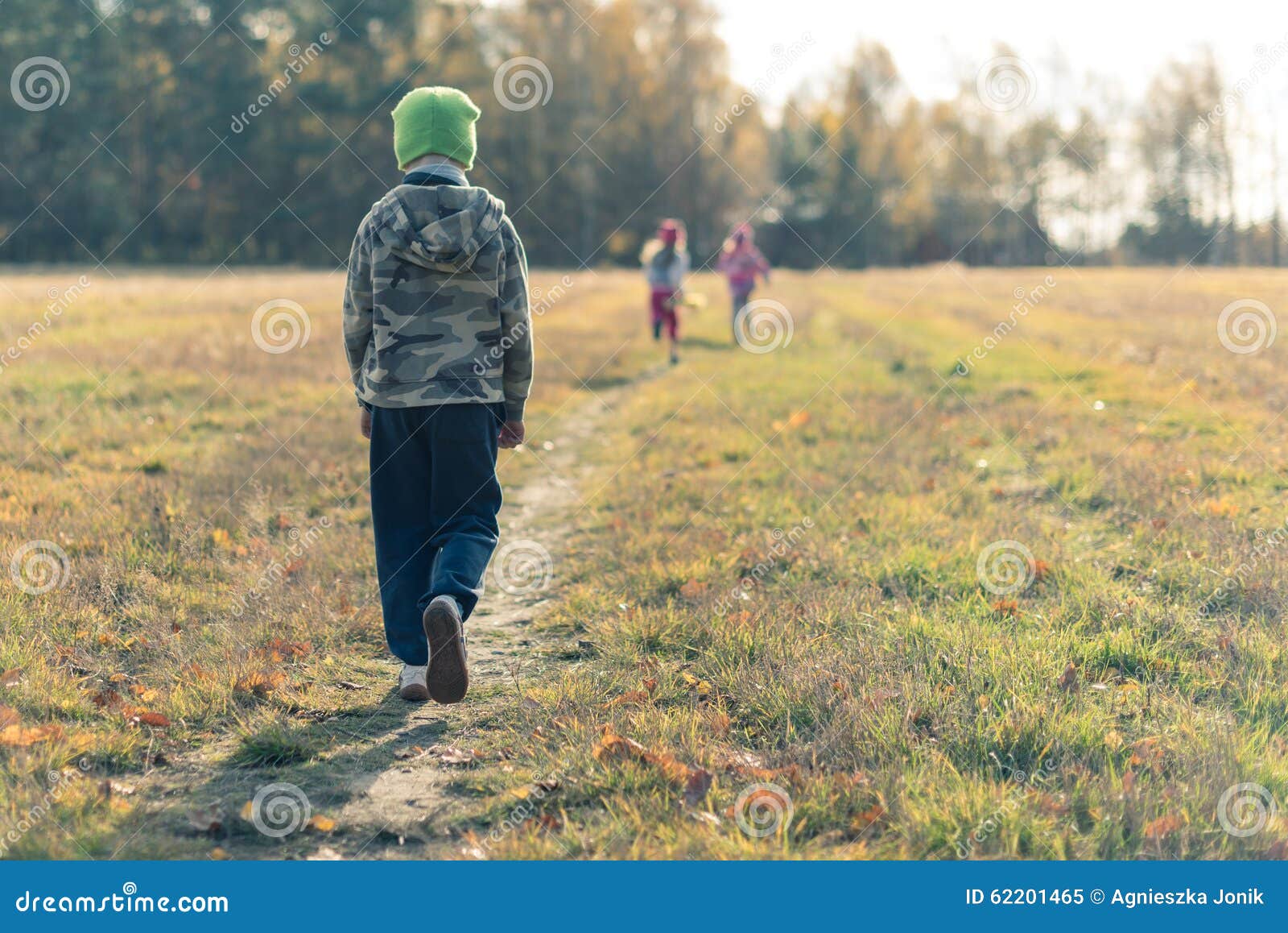 Sad Boy Walking Behind Laughing Children Stock Image - Image of lonely ...