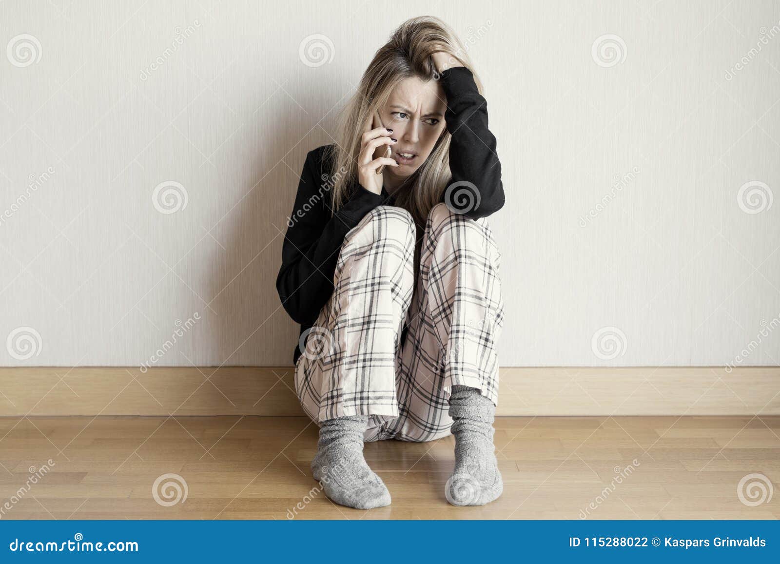 Sad woman talking on phone stock photo. Image of left - 115288022