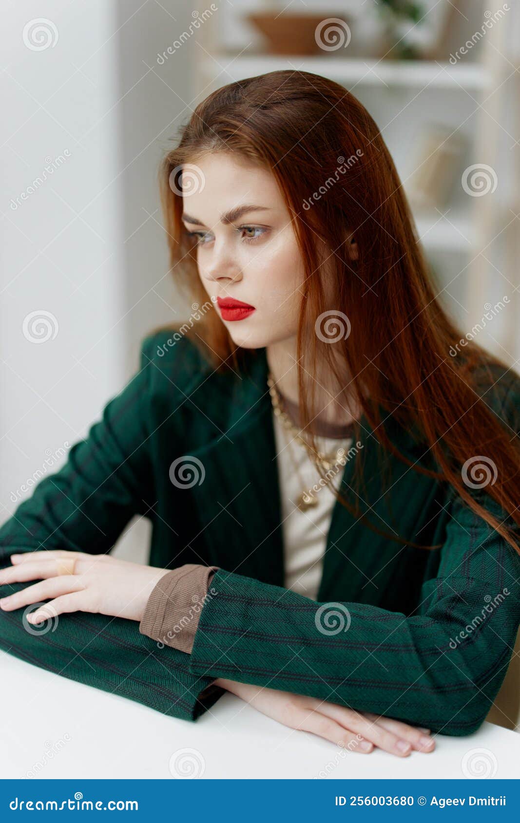 A Sad, Brooding, Tired Young Red-haired Woman at the Table is Thinking ...